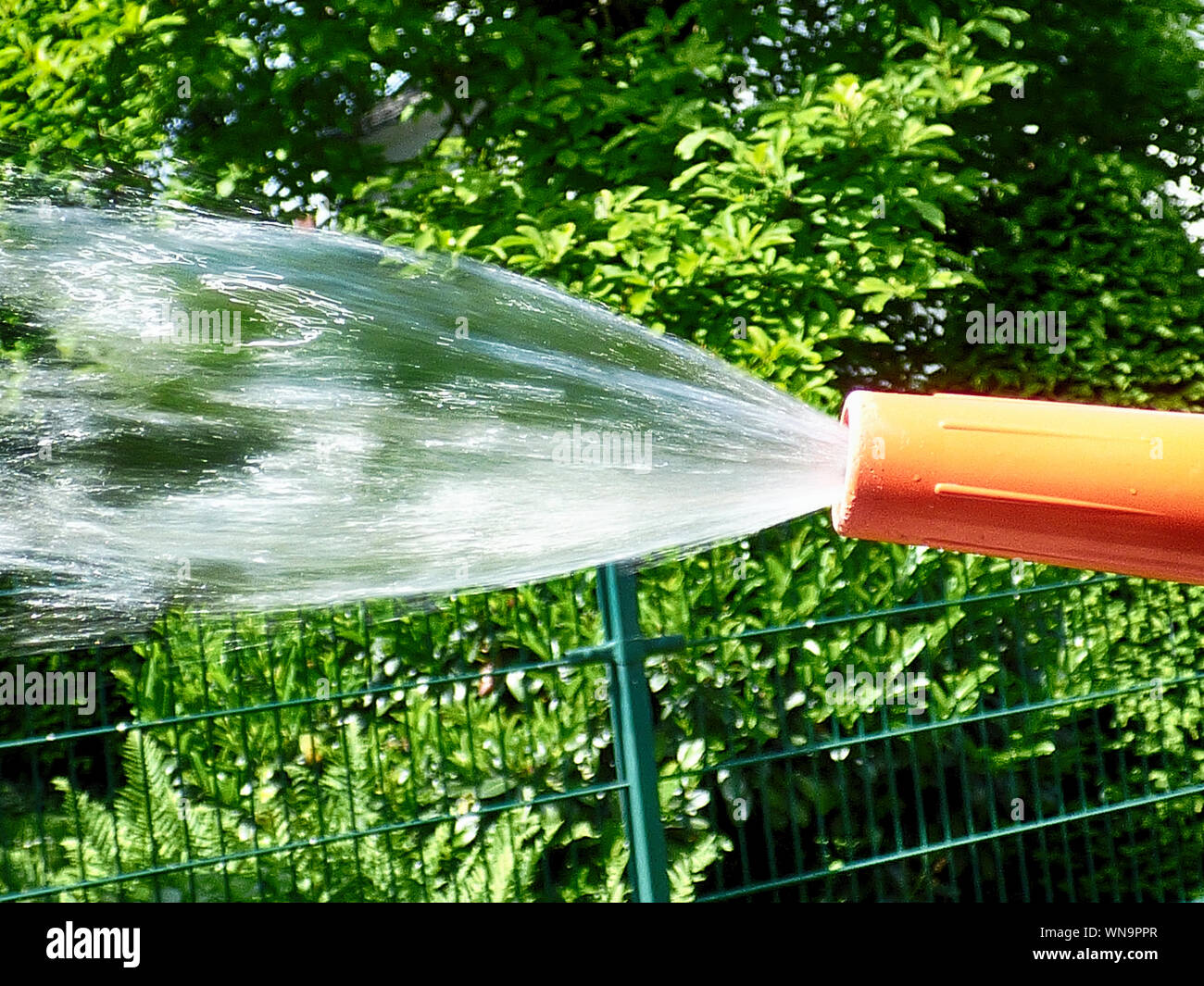 Spraying with hose hi-res stock photography and images - Alamy