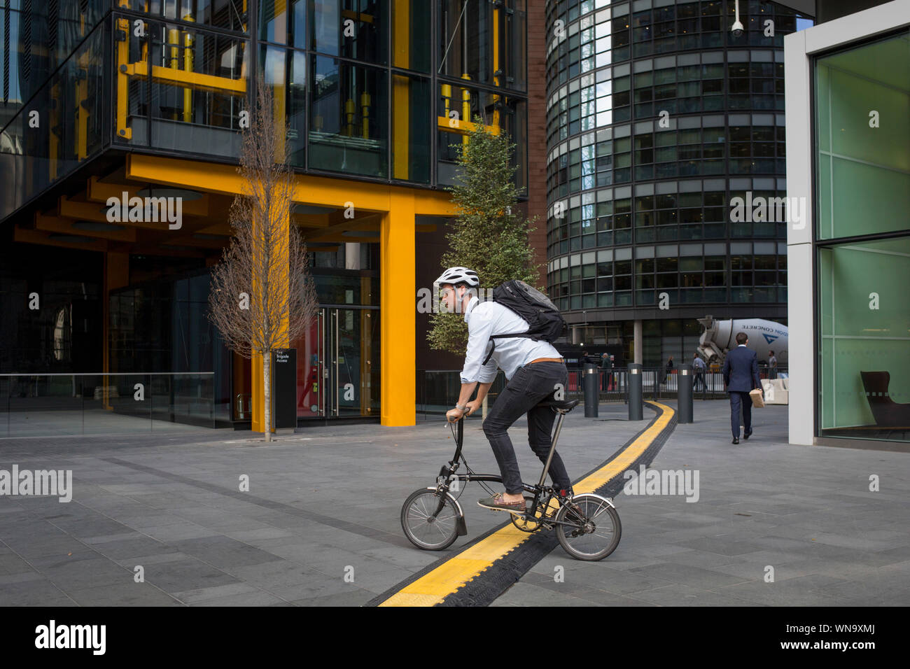 A cyclist crosses a yellow line that covers hazardous electrical ...