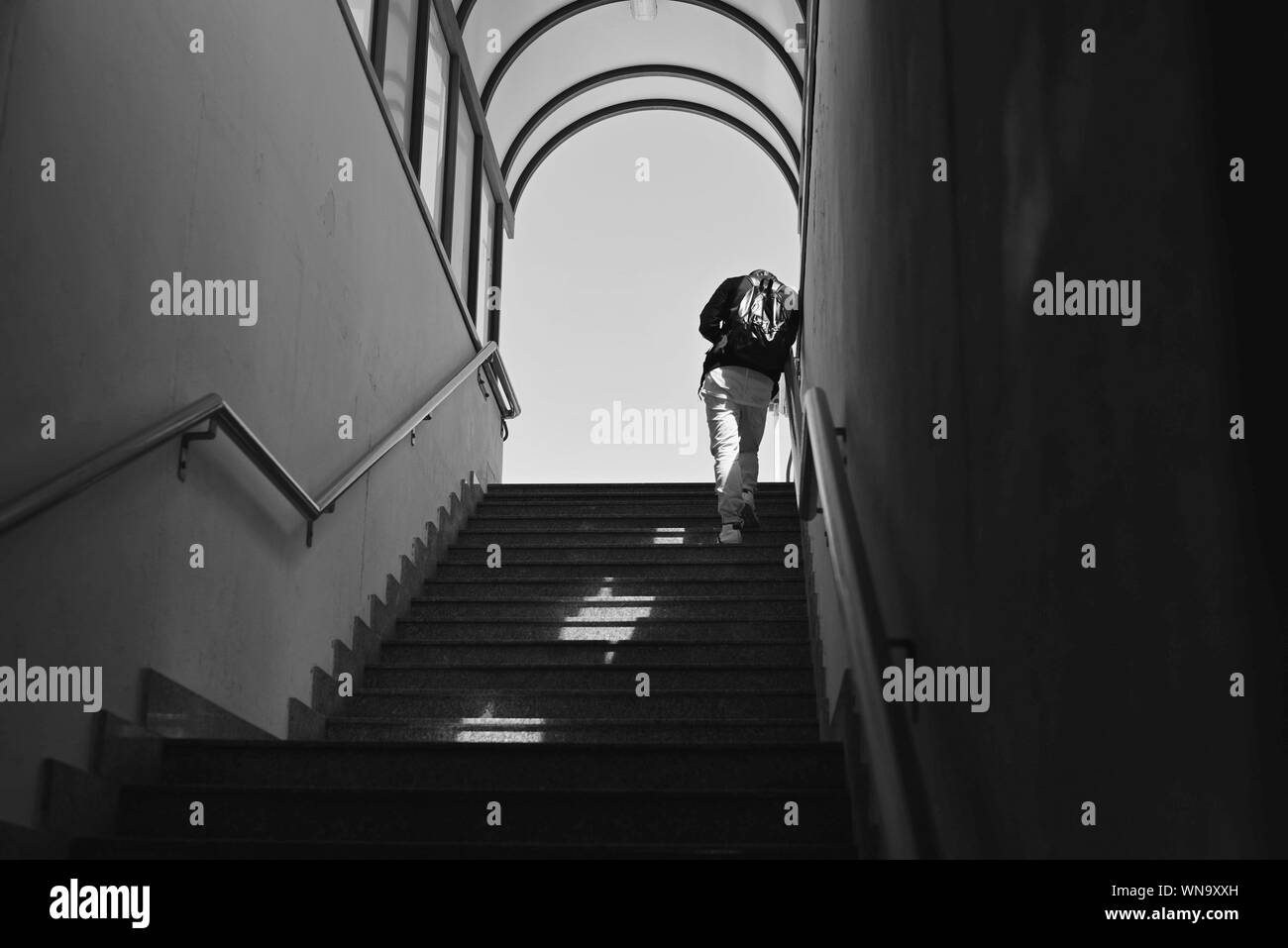 Man Walking Up Stairs Black and White Stock Photos & Images - Alamy