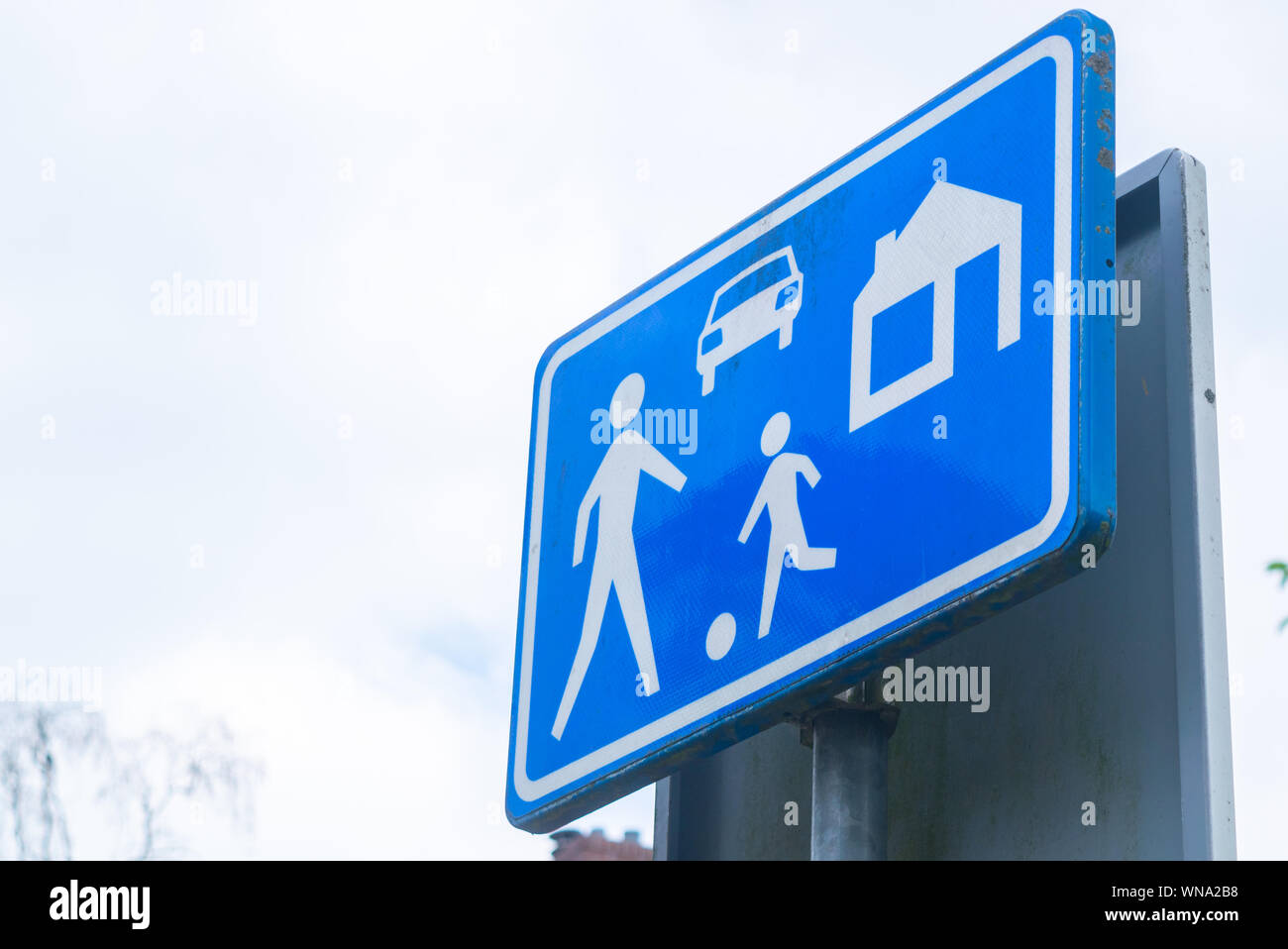 Street road sign kids playing hi-res stock photography and images - Alamy