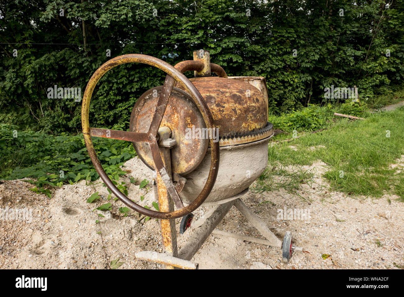 old and rusty mixer for concrete Stock Photo - Alamy