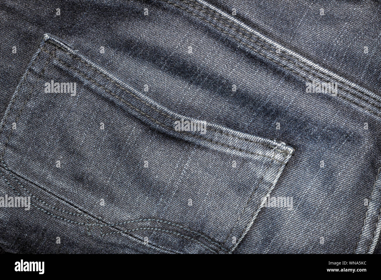 Background texture of old jeans with a pattern of wrinkles and bags ...