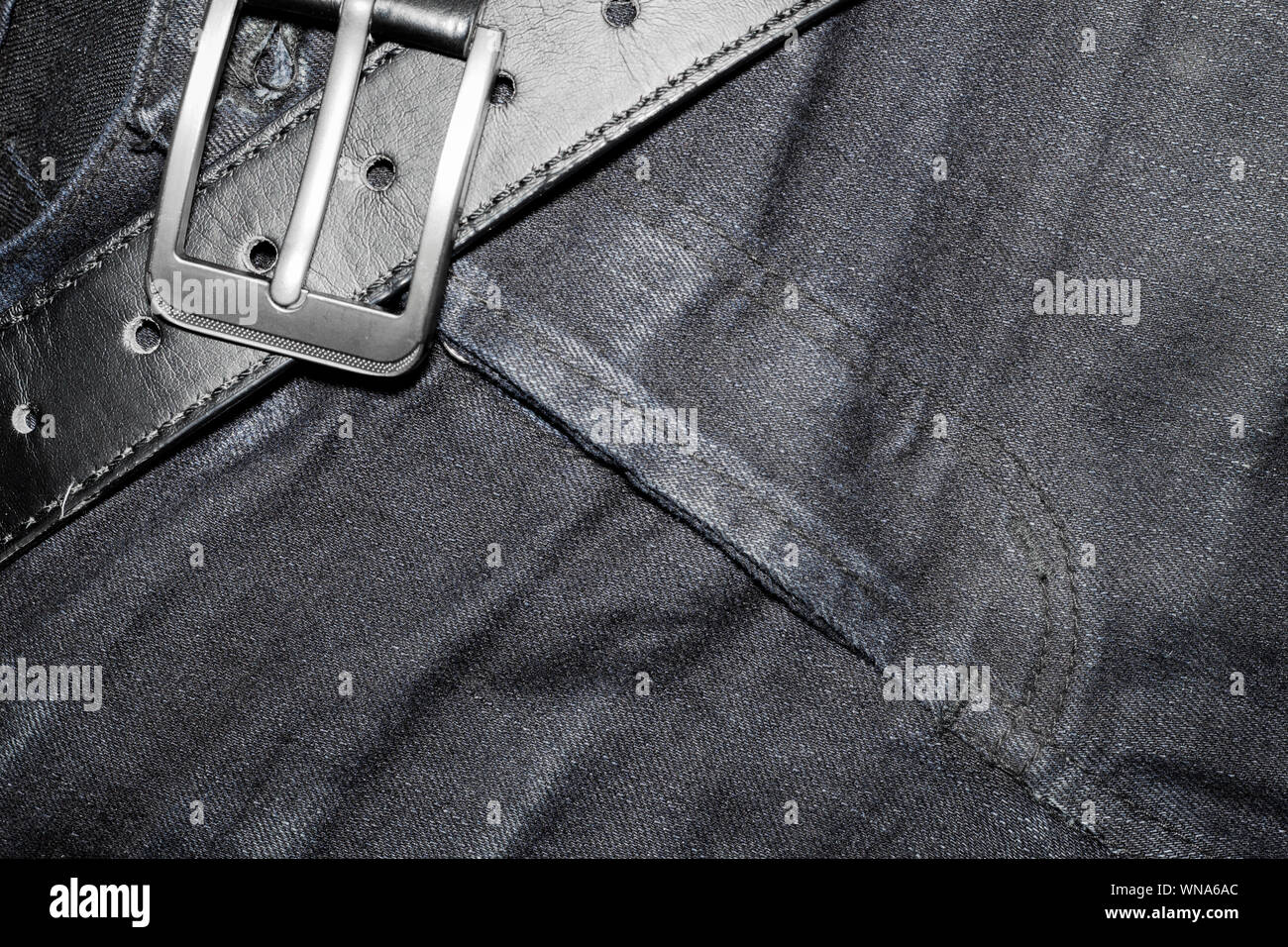 Texture of old jeans with wrinkles and belts Stock Photo - Alamy