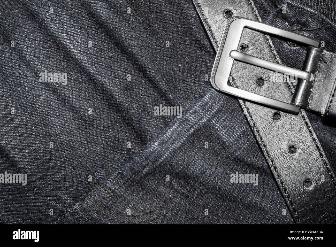 Texture of old jeans with wrinkles and belts Stock Photo - Alamy