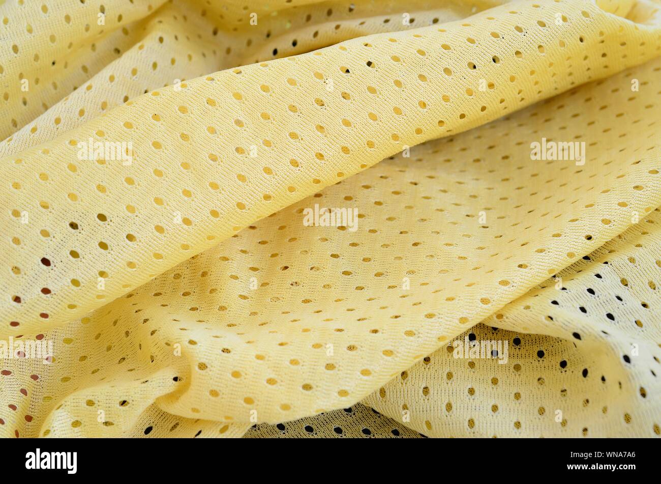 Yellow mesh sport wear fabric textile pattern background. Yellow color ...