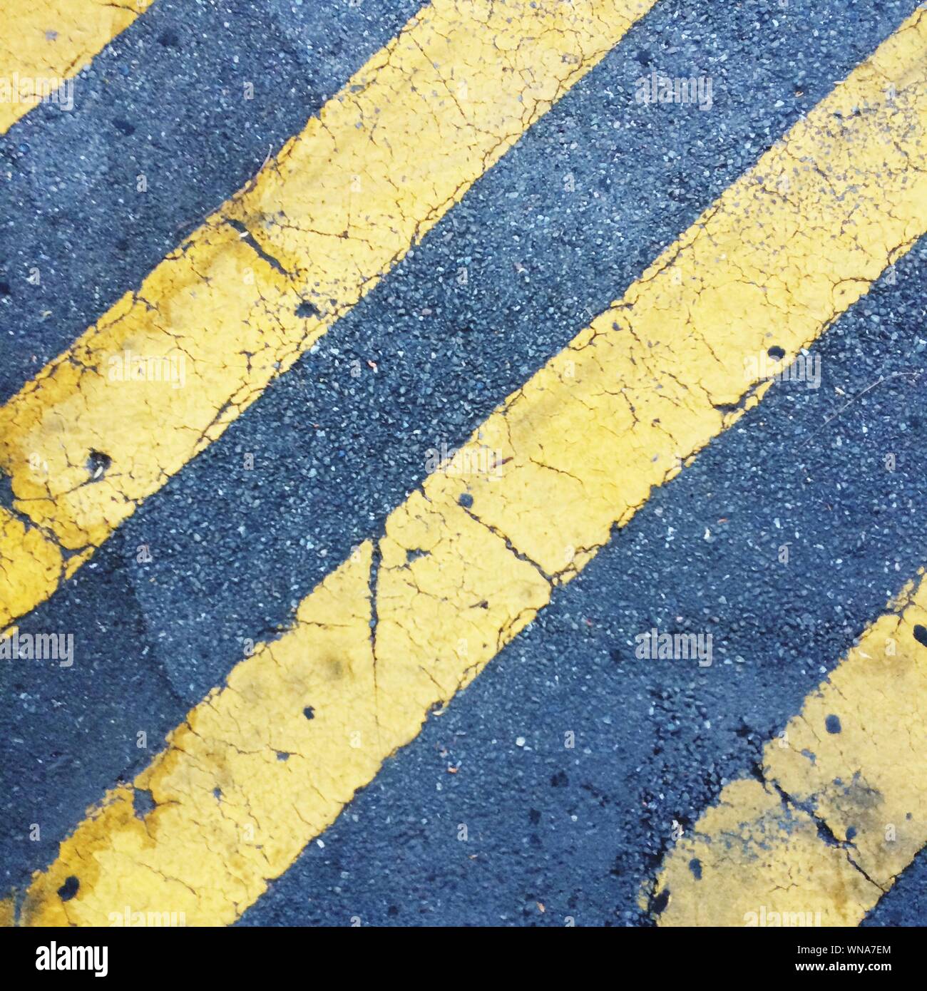 Yellow striped markings hi-res stock photography and images - Alamy
