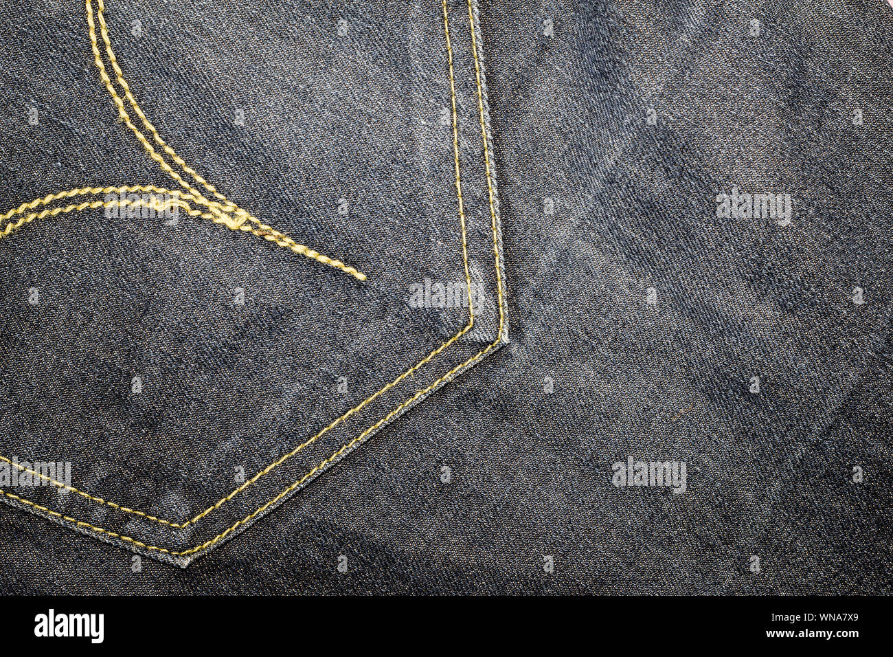 Background texture of old jeans with a pattern of wrinkles and bags ...
