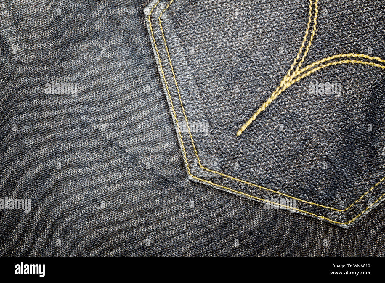 Background texture of old jeans with a pattern of wrinkles and bags ...
