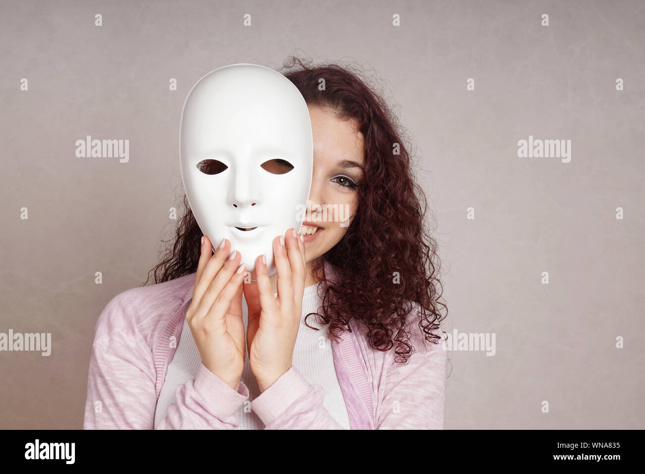 Woman Behind Mask High Resolution Stock Photography and Images - Alamy