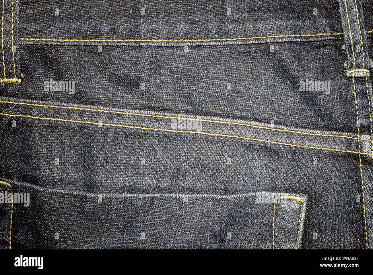 Background texture of old jeans with a pattern of wrinkles and bags ...