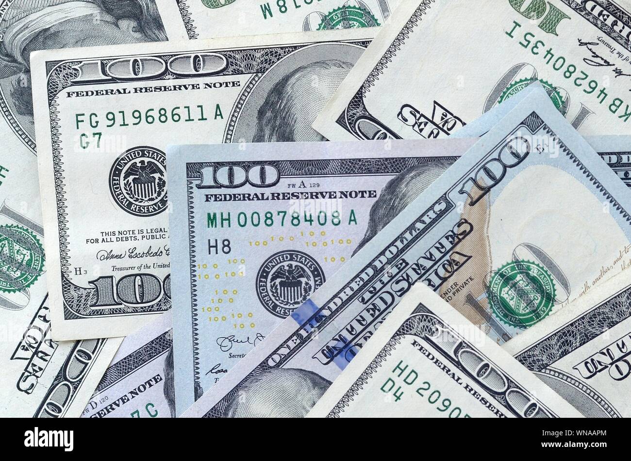 Business background with many hundred dollar bills. US currency money ...