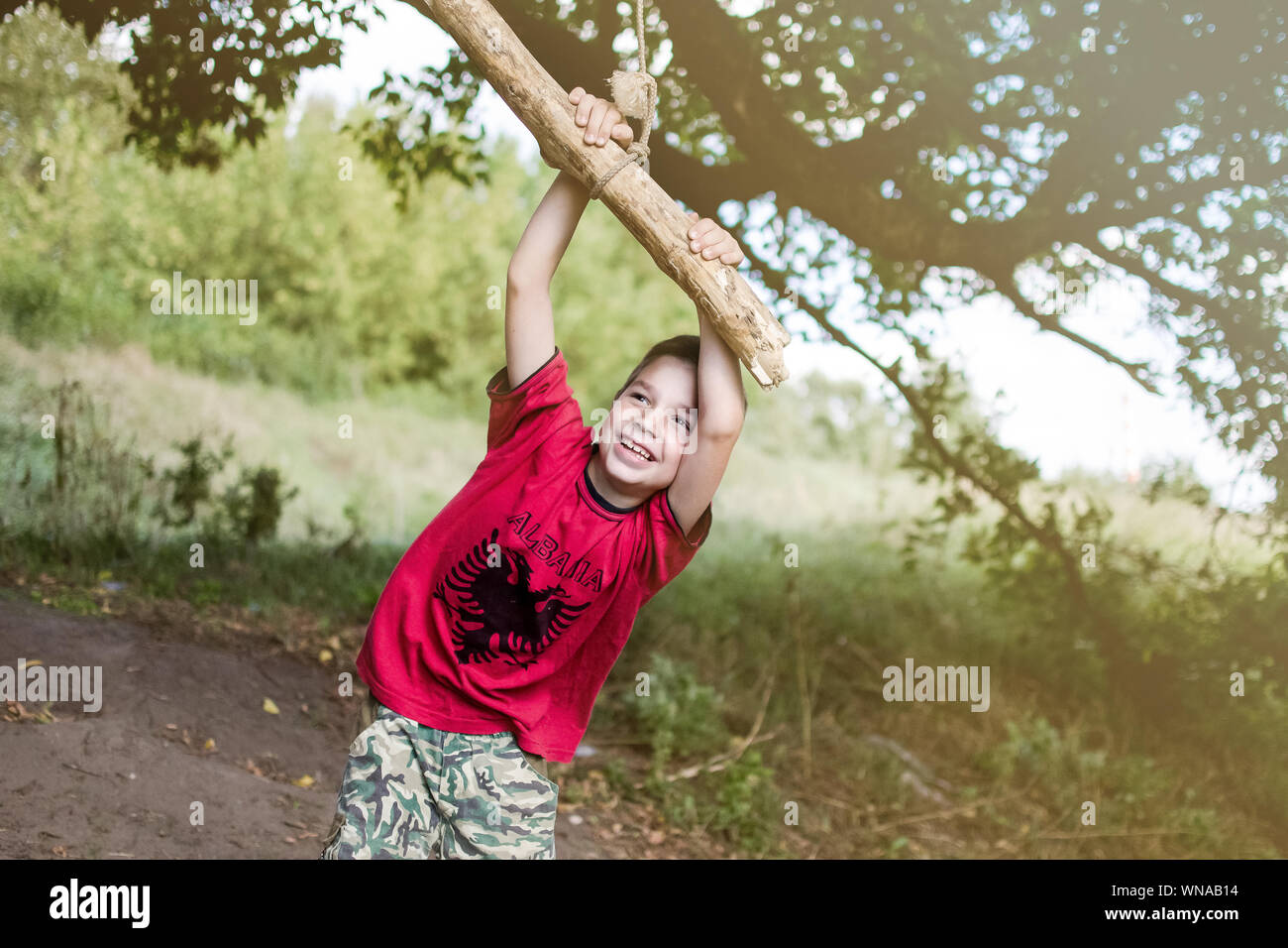 Happy boy swing boy happy swing hi-res stock photography and images - Alamy