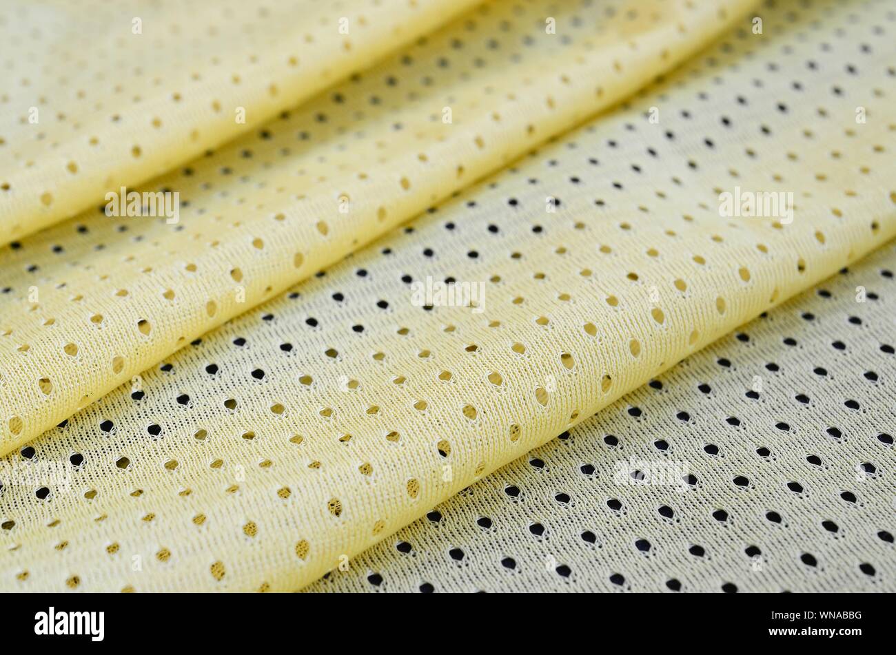 Yellow mesh sport wear fabric textile pattern background. Yellow color ...