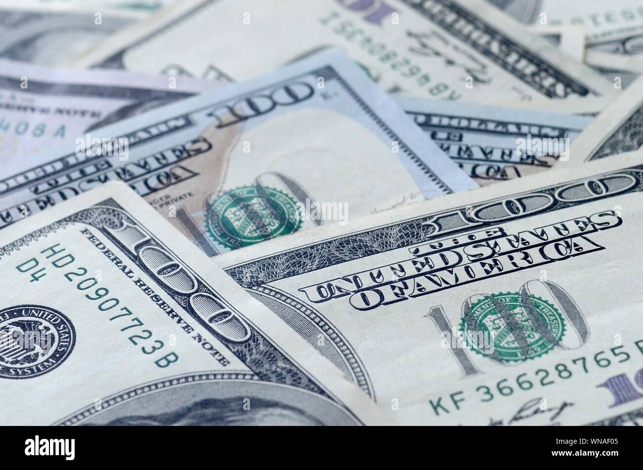 Business background with many hundred dollar bills. US currency money ...