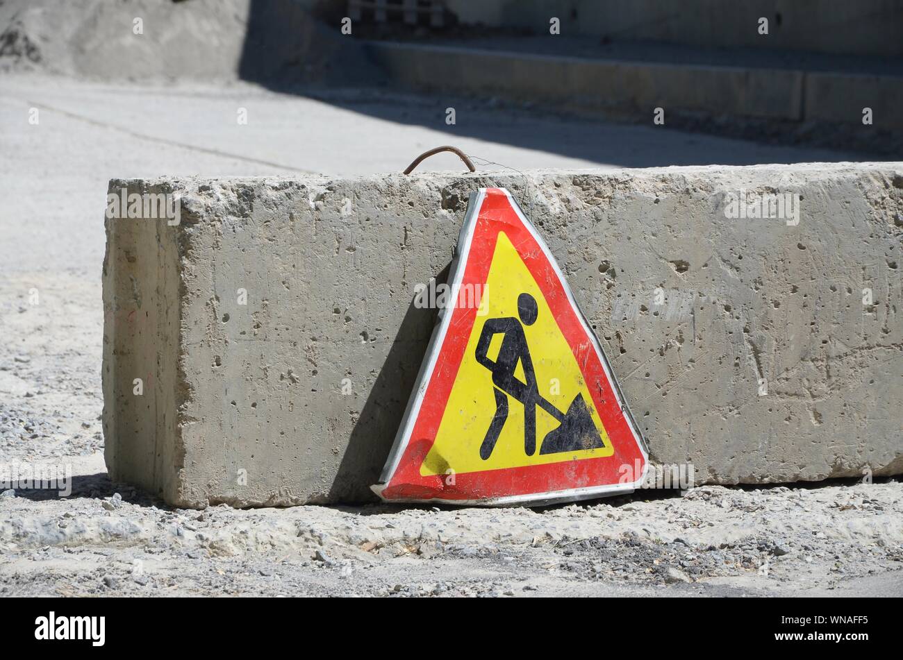 Road works sign for construction works in city street. Road under ...