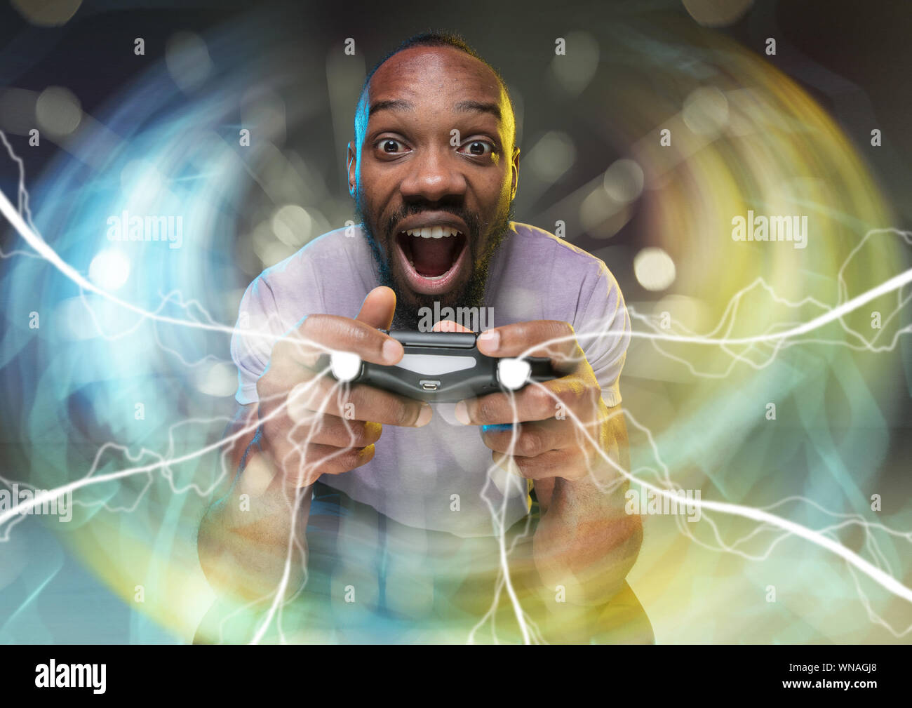 Full immersion in gameplay. Young man holding a video game controller ...