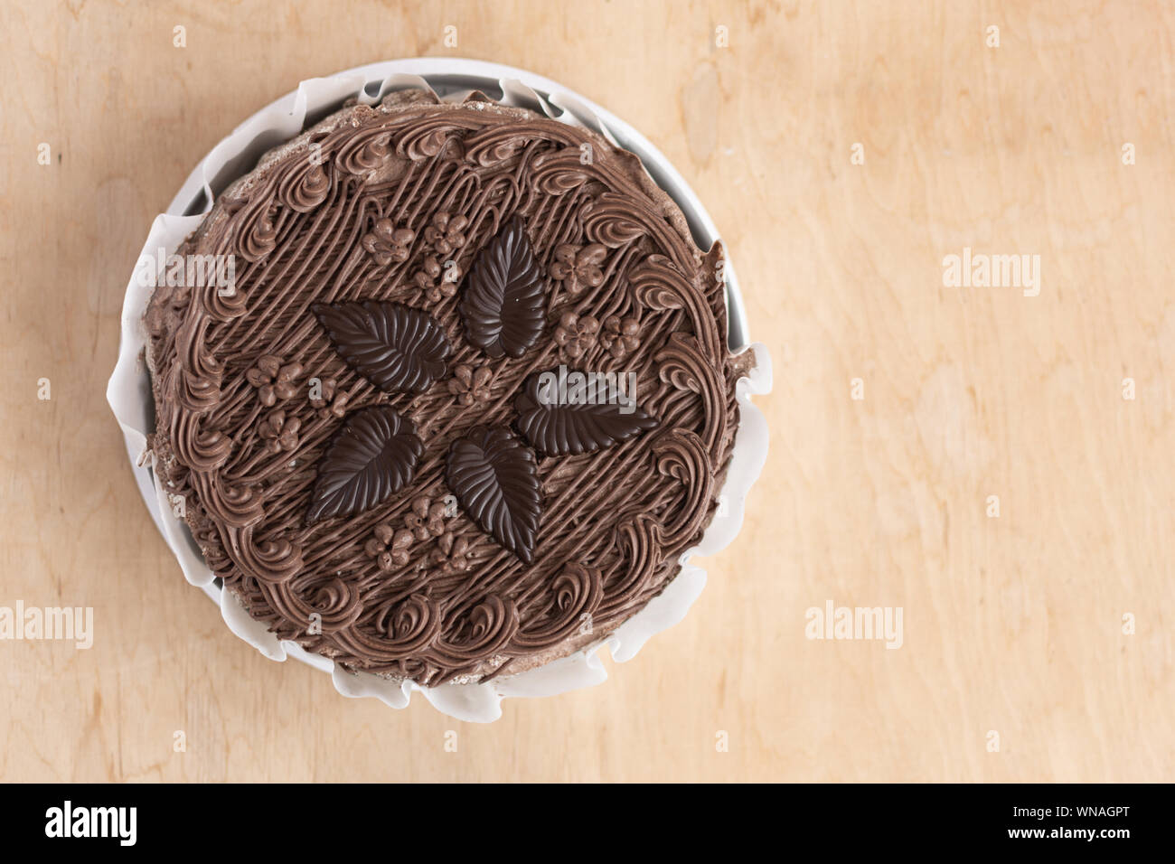 Chocolate cake top view on wooden background table. Sweet dessert Stock ...