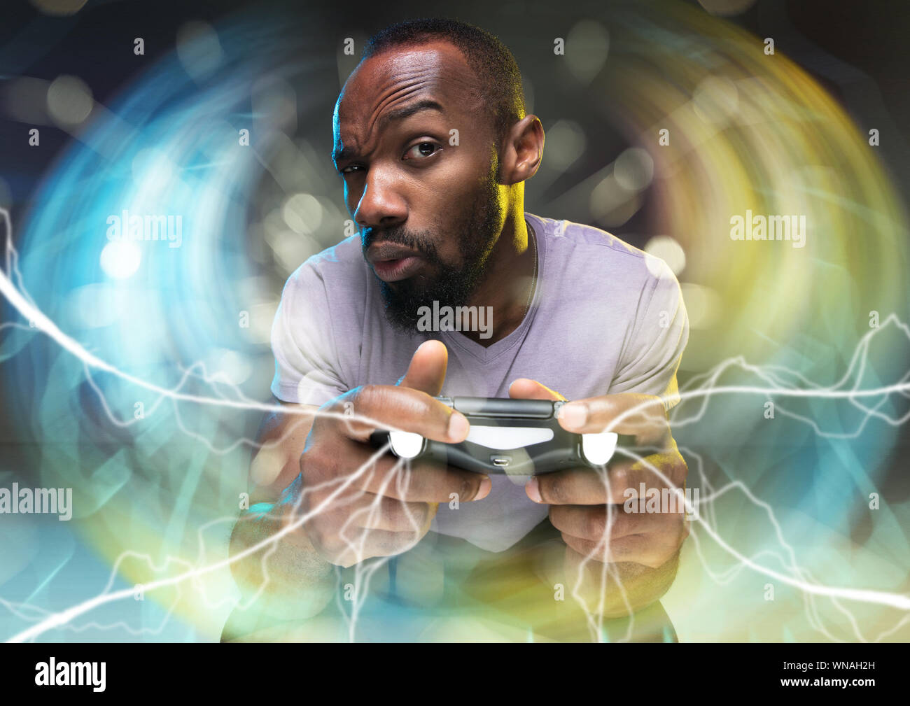 Full immersion in gameplay. Young man holding a video game controller ...