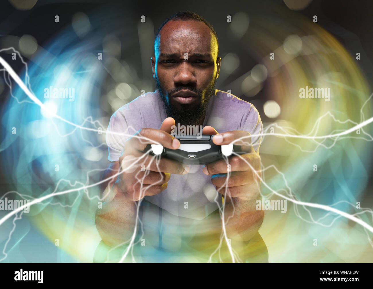 Full immersion in gameplay. Young man holding a video game controller ...