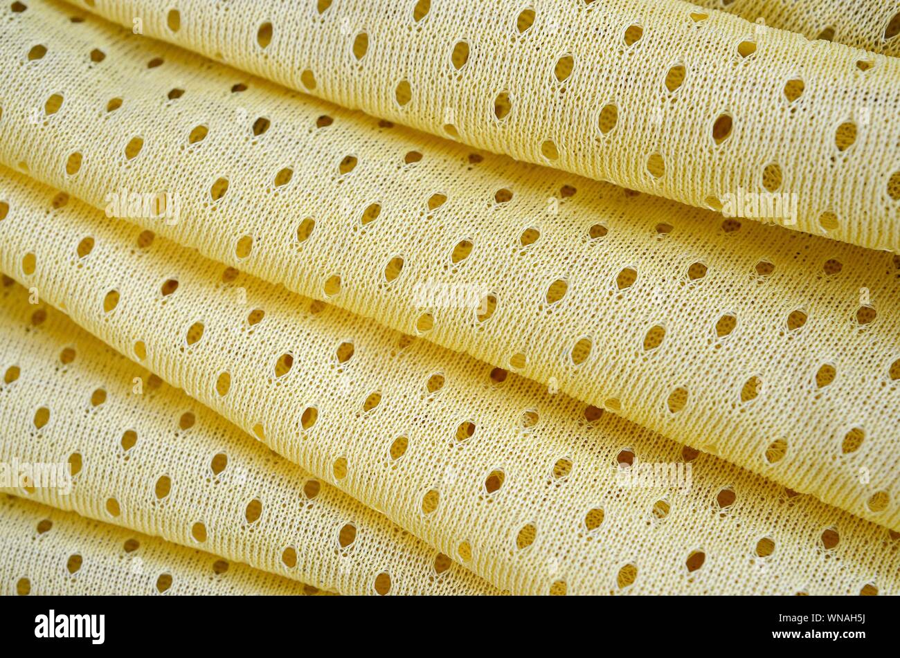 Yellow mesh sport wear fabric textile pattern background. Yellow color ...