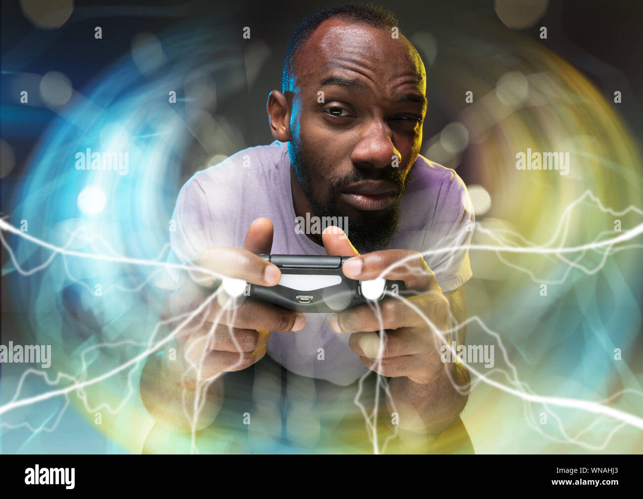 Full immersion in gameplay. Young man holding a video game controller ...