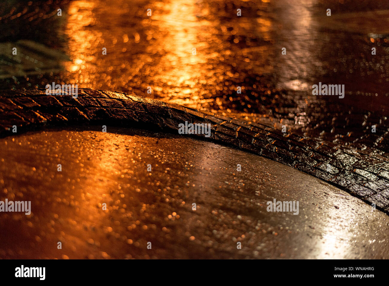 Rainy cobbled street hi-res stock photography and images - Alamy