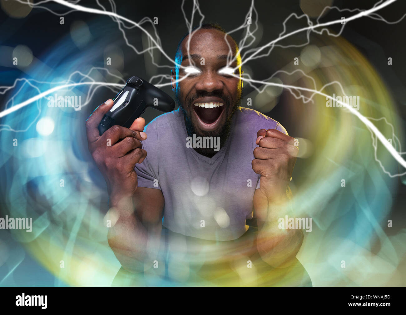 Full immersion in gameplay. Young man holding a video game controller ...