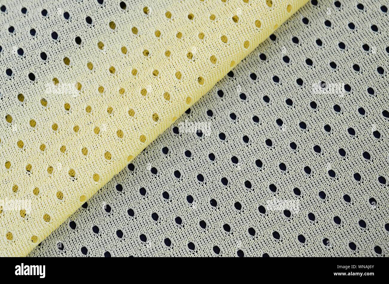 Yellow mesh sport wear fabric textile pattern background. Yellow color ...