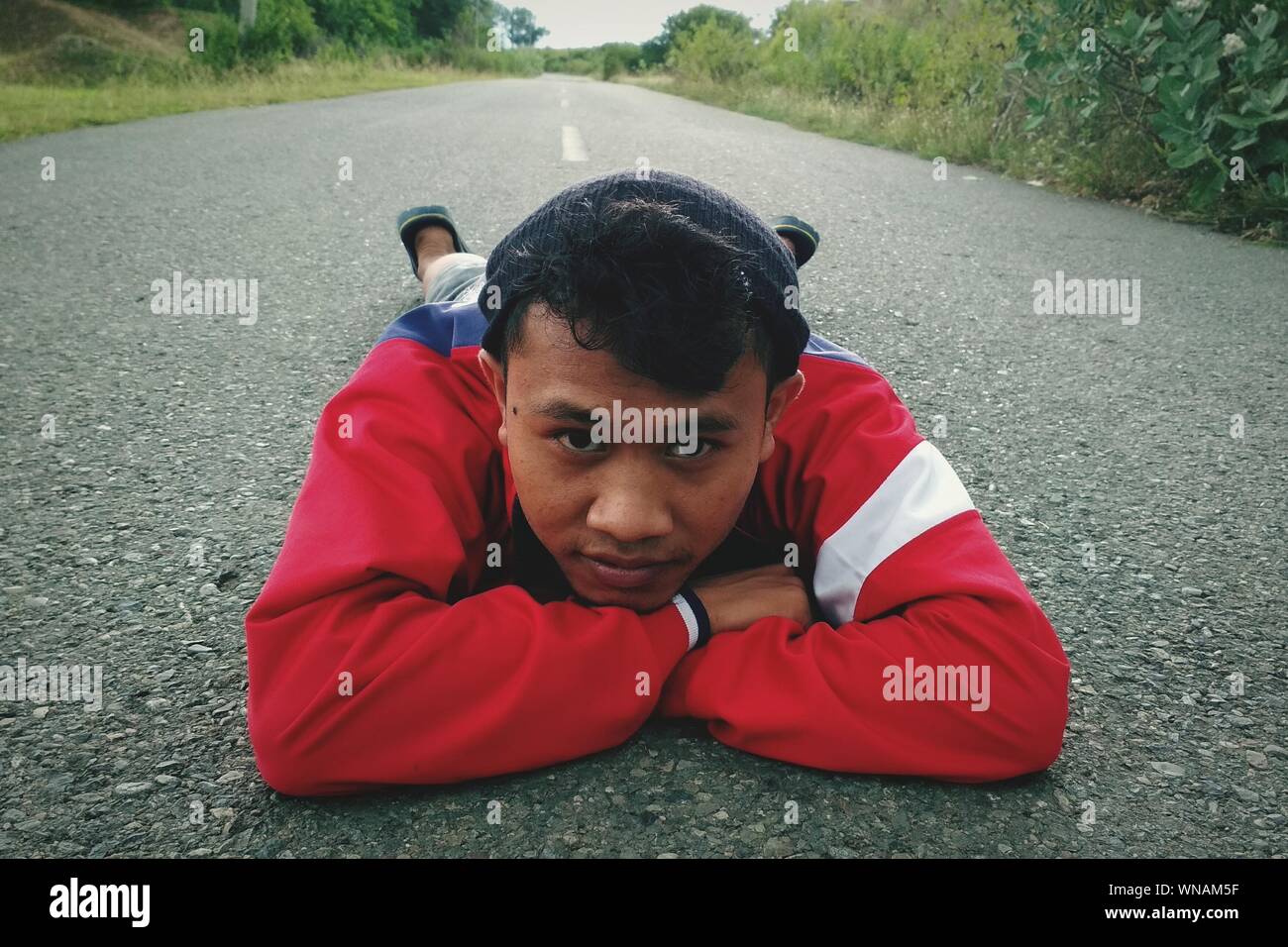 Man lying down road hi-res stock photography and images - Alamy