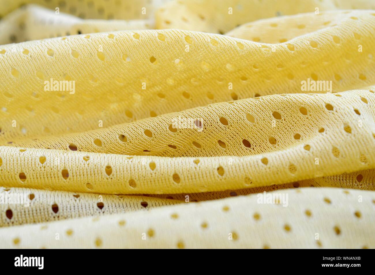 Yellow mesh sport wear fabric textile pattern background. Yellow color ...