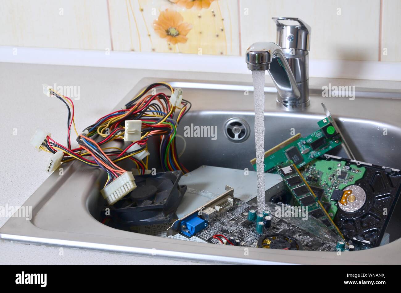 Personal computer cleaning metaphoric concept. Hardware in kitchen sink ...