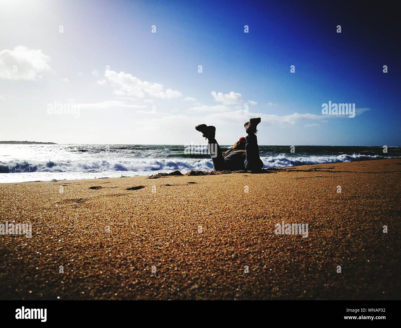 Man lying beach outdoors hi-res stock photography and images - Alamy