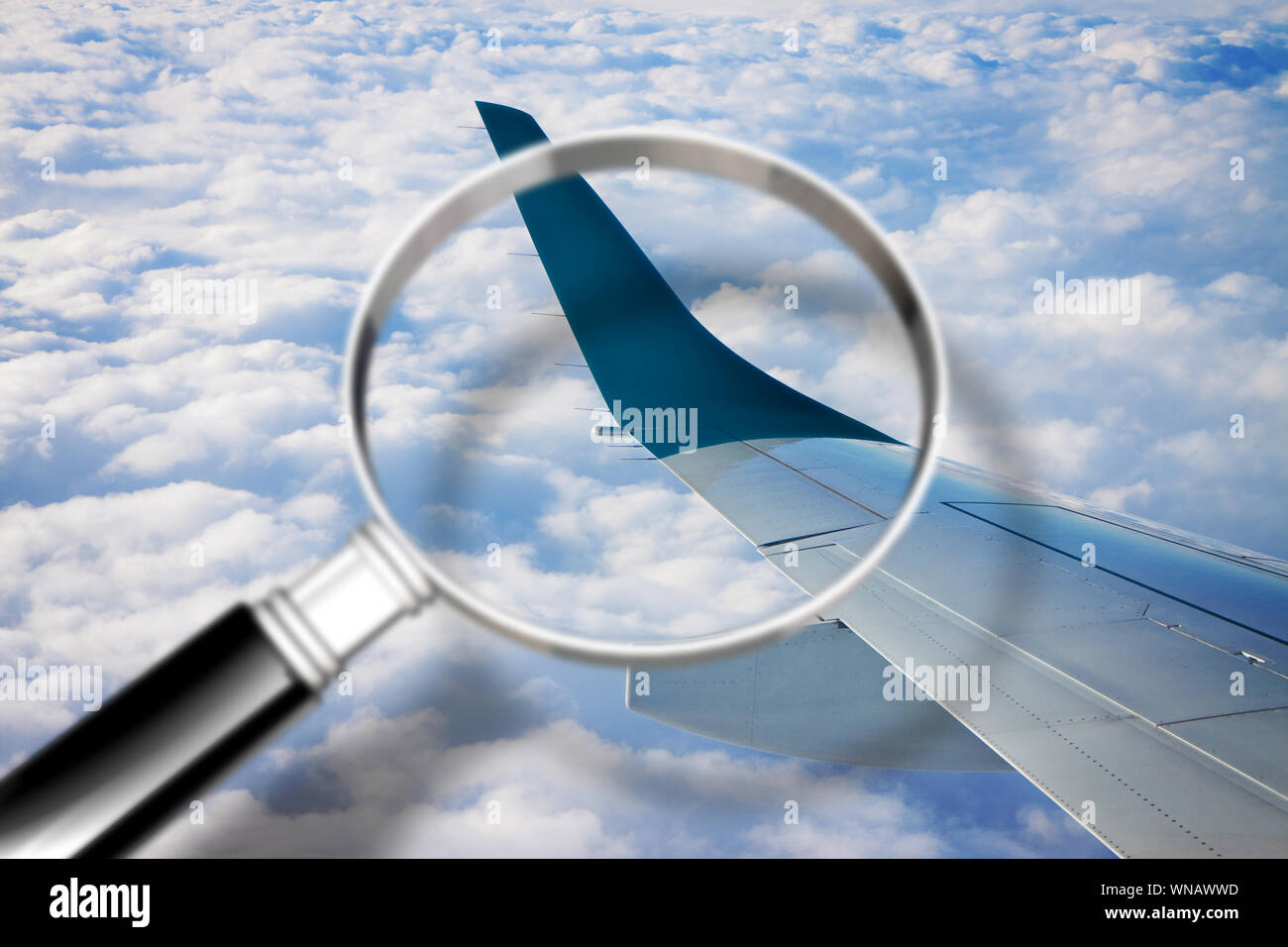 Airplane wing above the clouds - surveillance concept image with ...