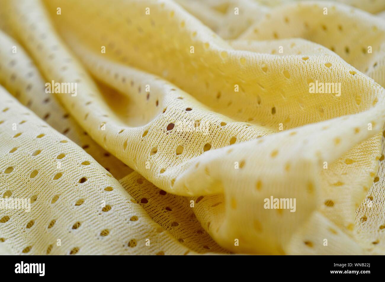 Yellow mesh sport wear fabric textile pattern background. Yellow color ...