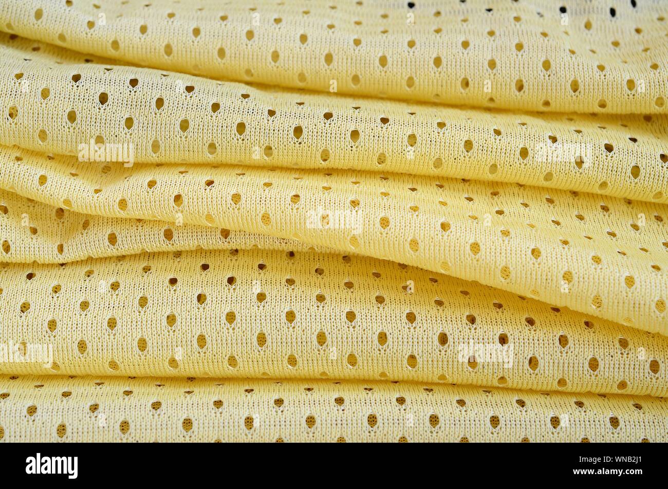 Yellow mesh sport wear fabric textile pattern background. Yellow color ...