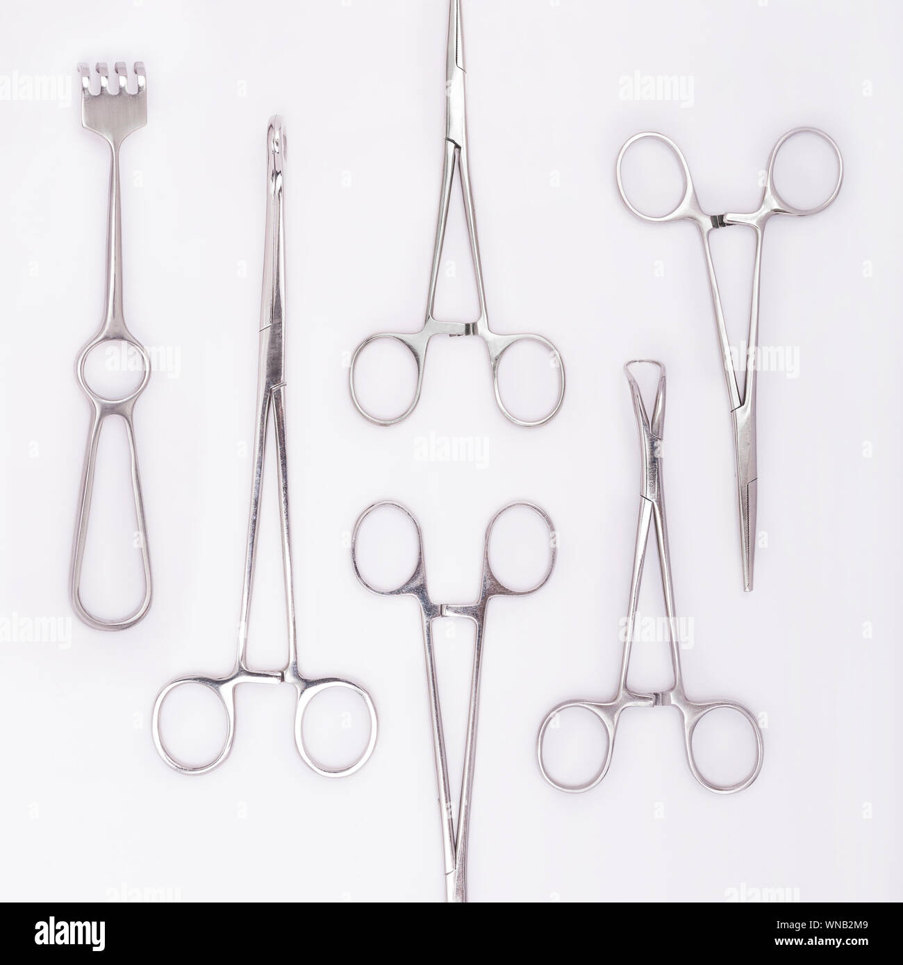 Close-up of steel surgical instruments on white background Stock Photo ...