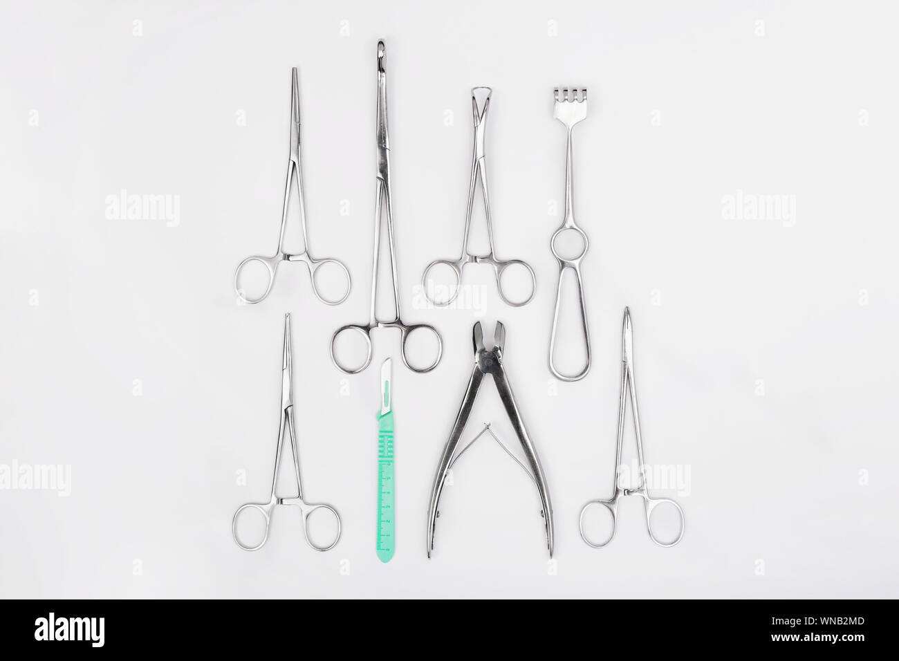 Metal surgical instruments on white background Stock Photo - Alamy