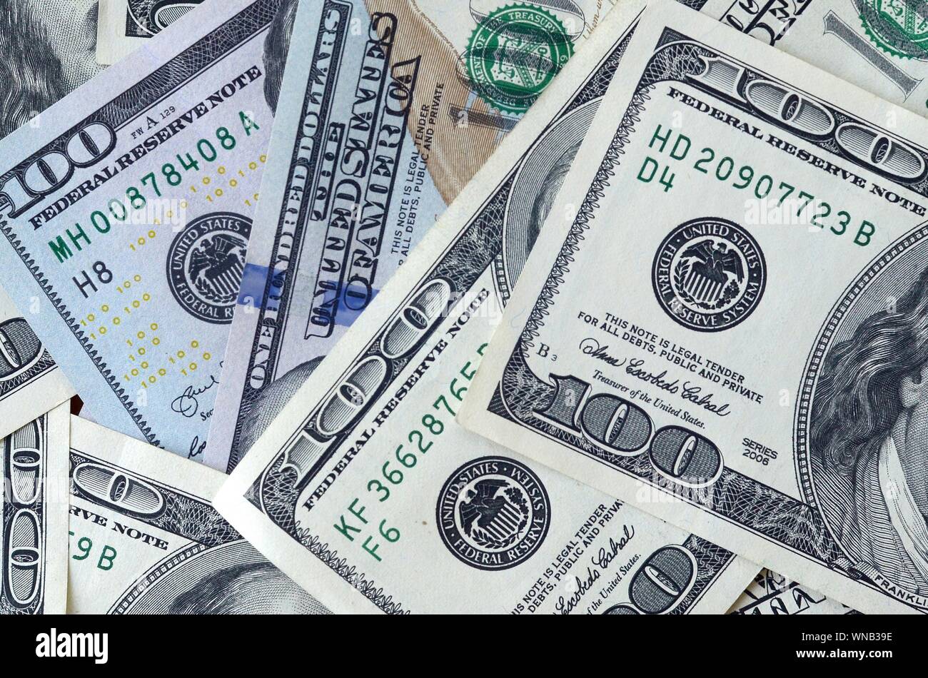 Business background with many hundred dollar bills. US currency money ...