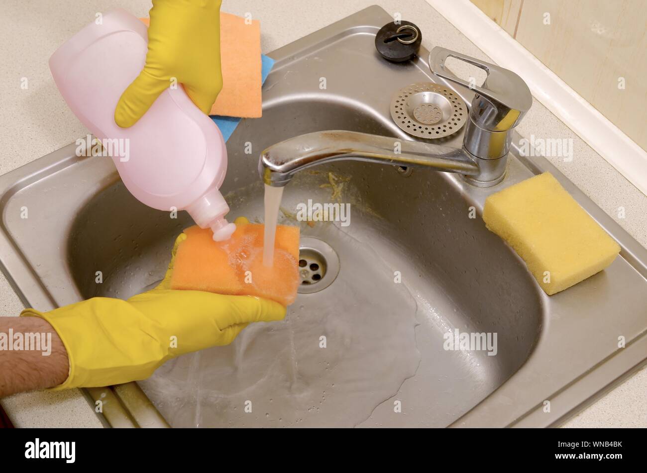 People housework washing-up and housekeeping concept. Cleaner applying ...