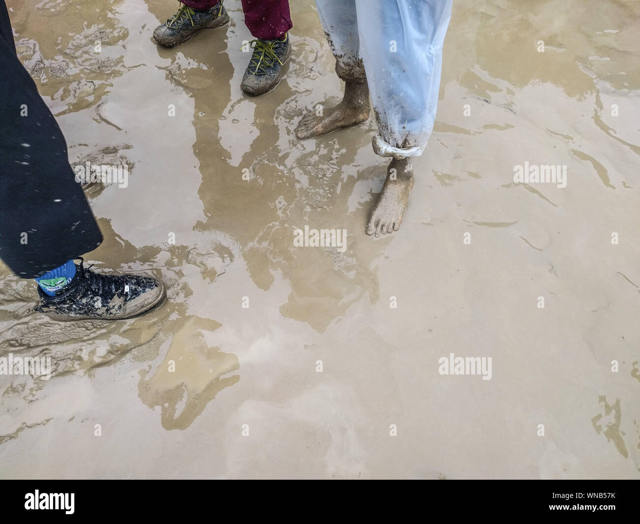 Men in mud hi-res stock photography and images - Alamy