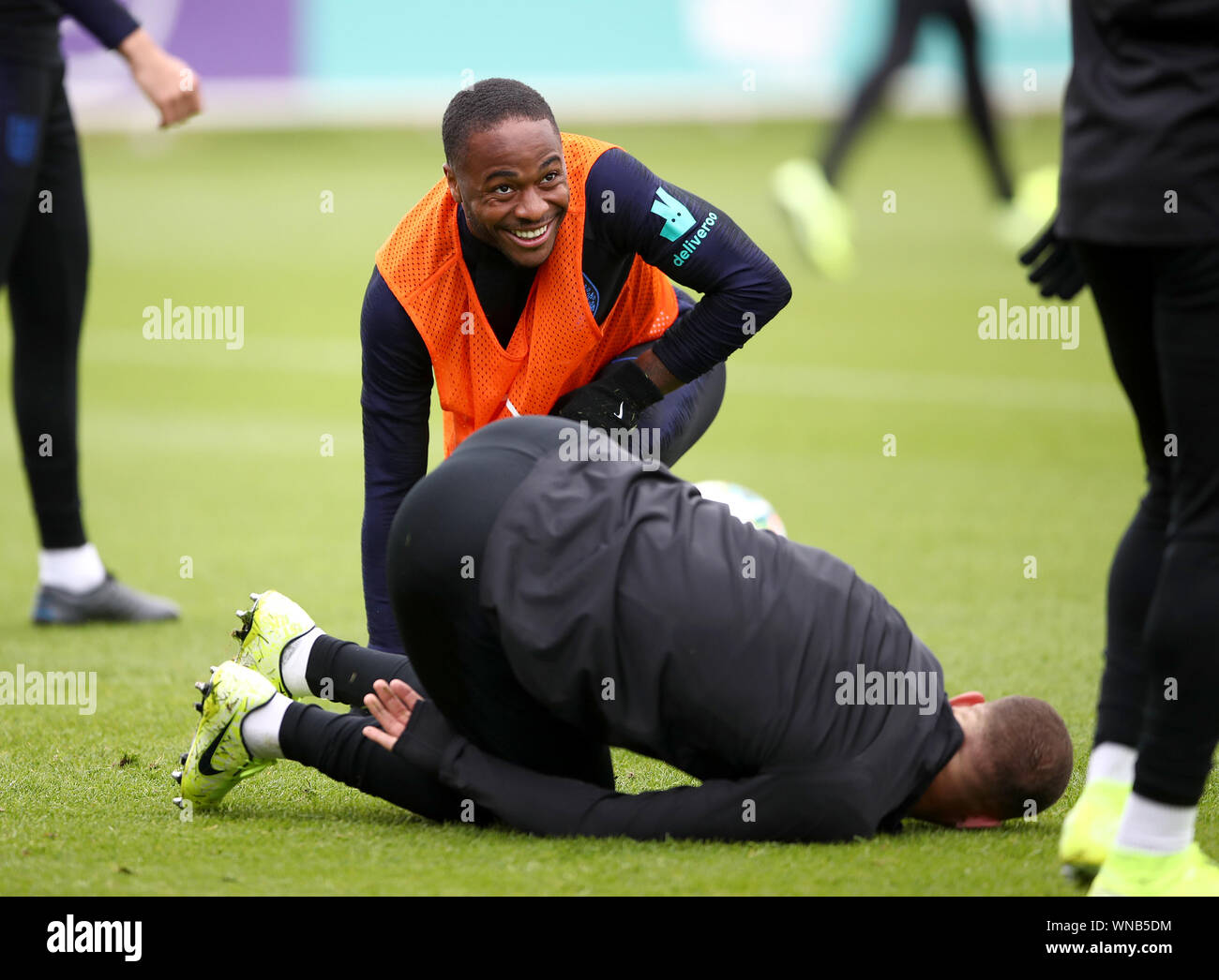 England's Raheem Sterling (top) and Ross Barkley joke around during a ...