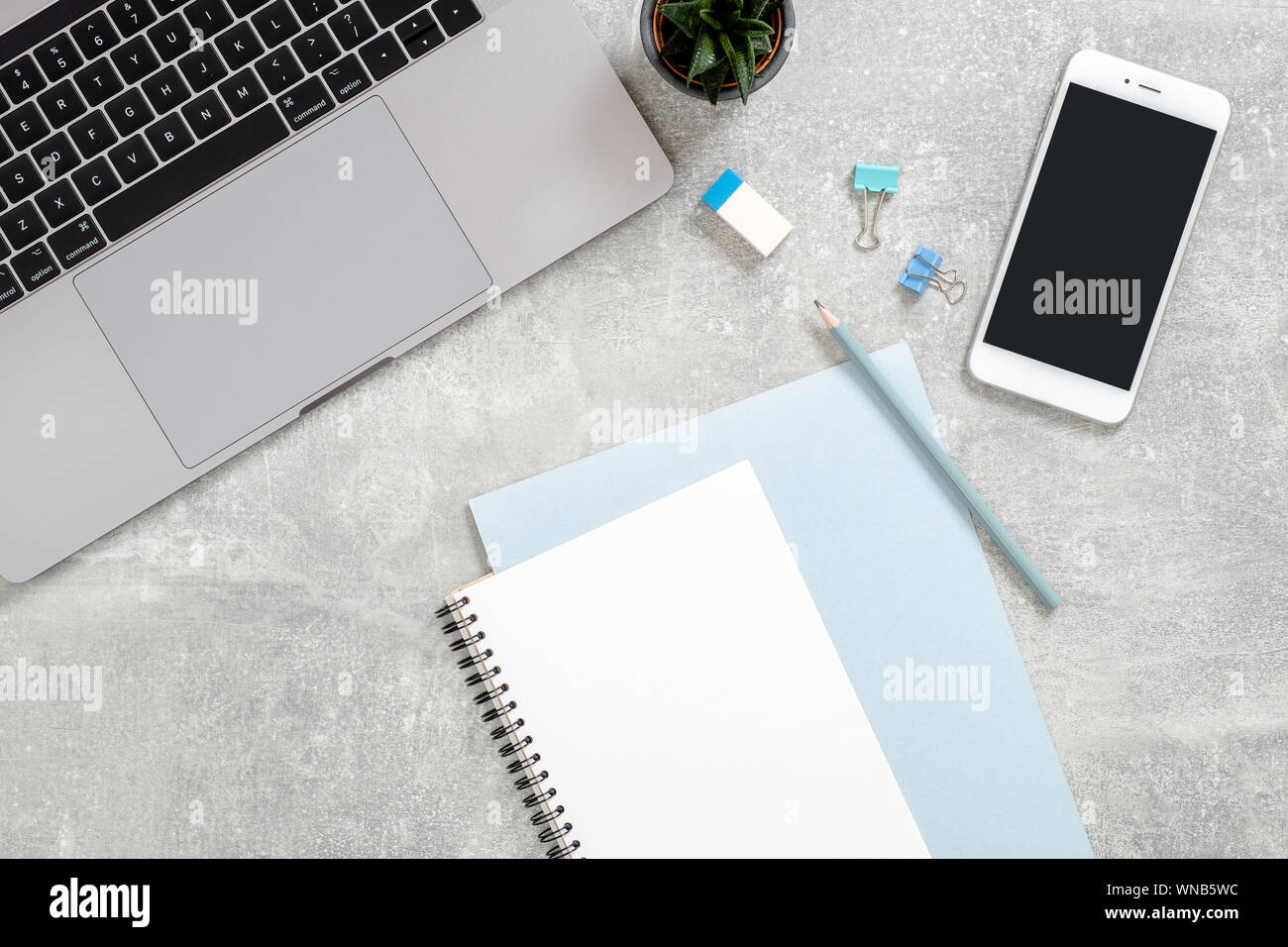 Stylish office table desk. Workspace with laptop computer, diary ...