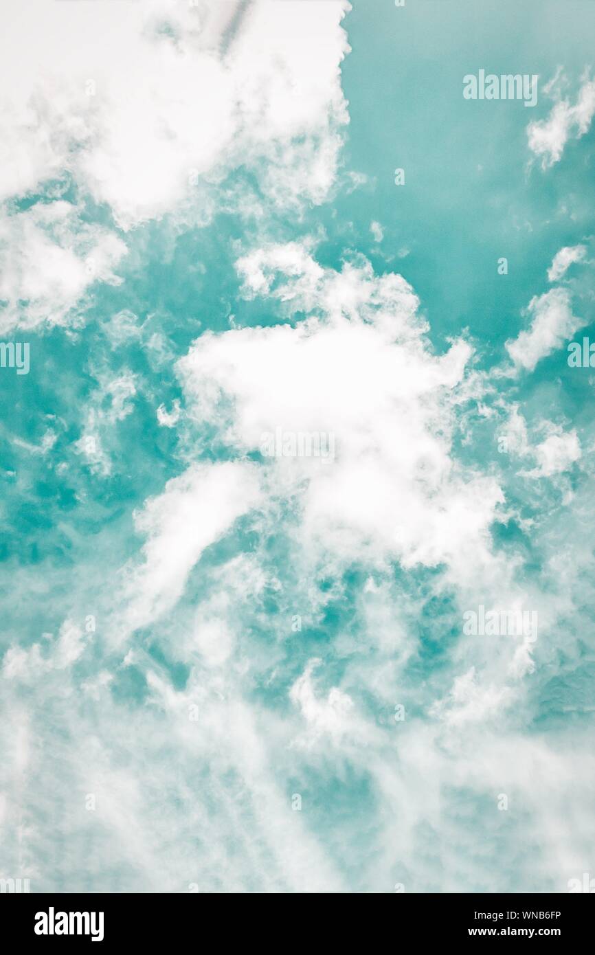 Beautiful white soft fluffy clouds on a cold green sky background Stock ...