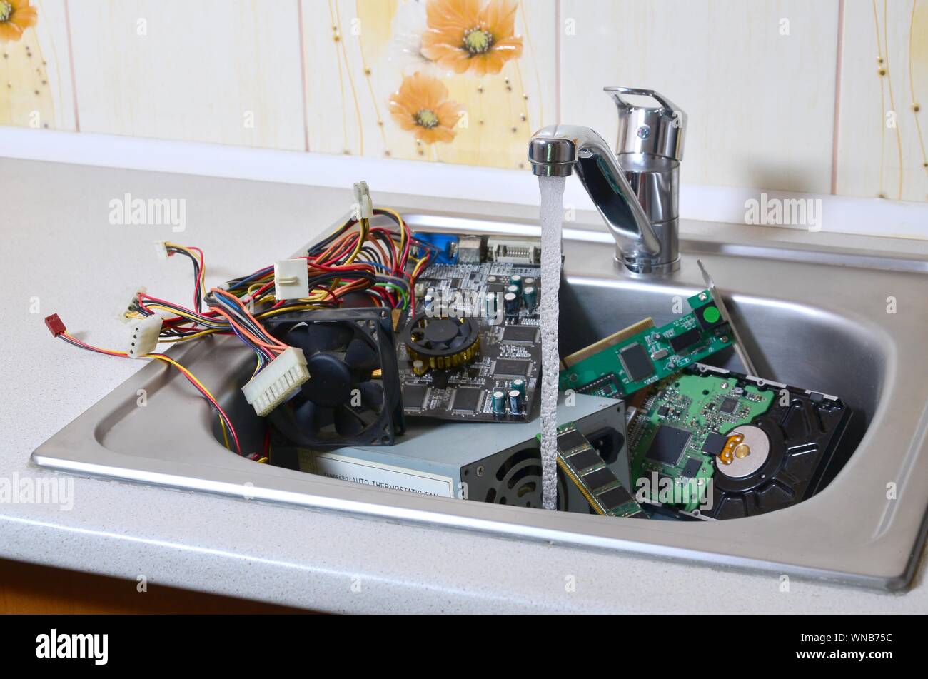 Personal computer cleaning metaphoric concept. Hardware in kitchen sink ...