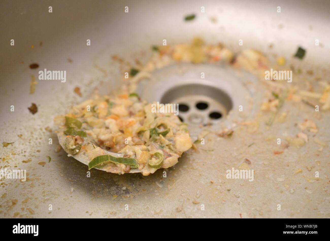 Close up on dirty clogging kitchen sink drain. Blur and selective focus ...