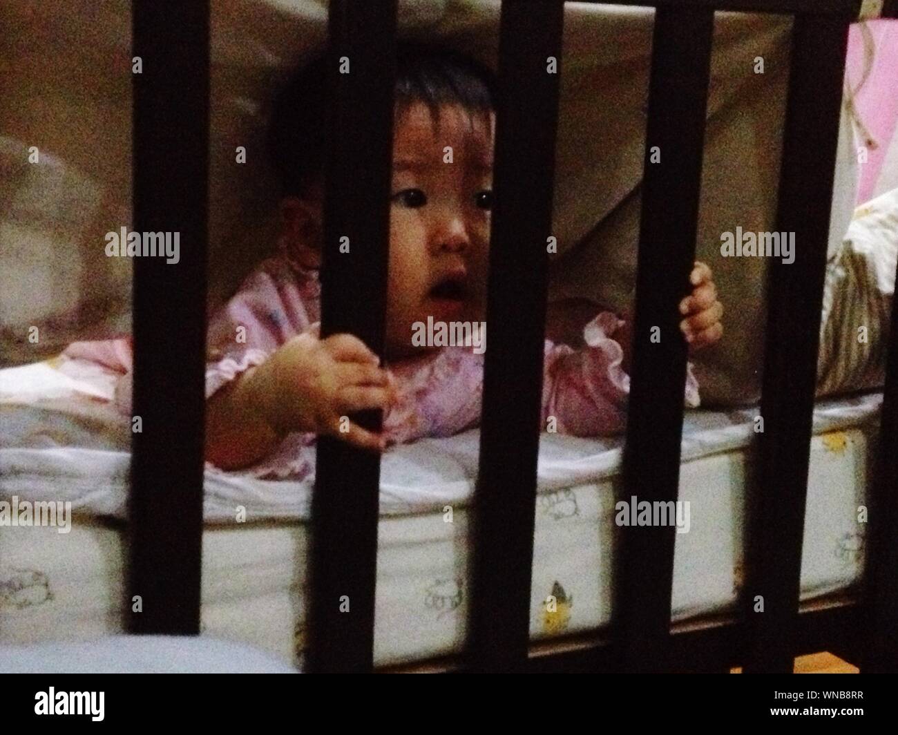 Baby in the cradle hi-res stock photography and images - Alamy