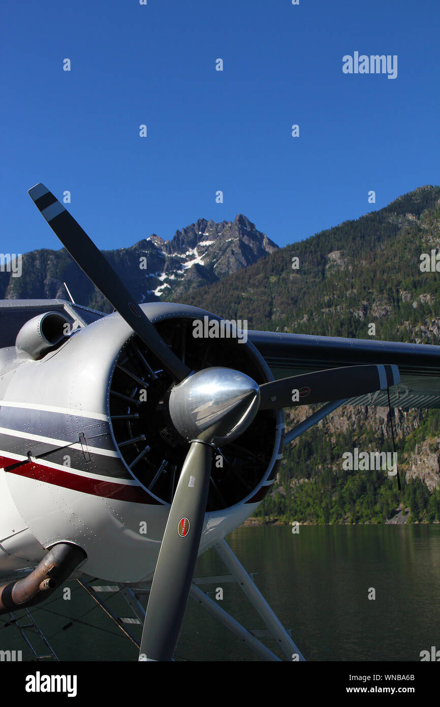 Airplane over mountain lake hi-res stock photography and images - Alamy
