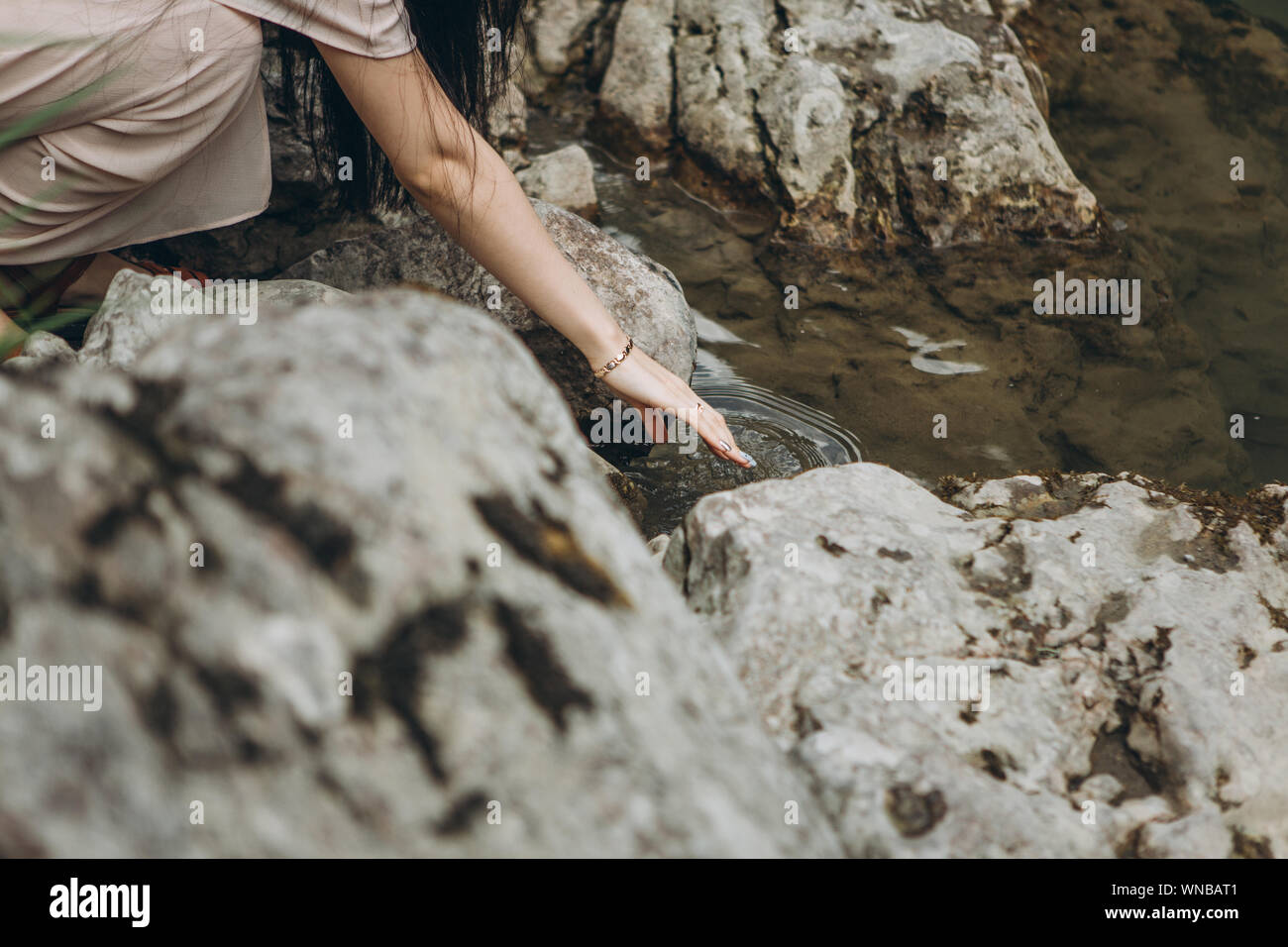 Girl touching water hi-res stock photography and images - Alamy