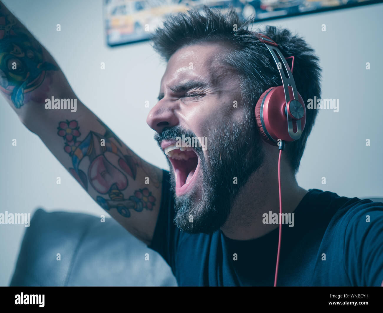 Man screaming with headphones hi-res stock photography and images - Alamy