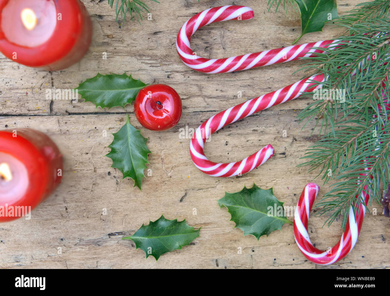 top view on candy canes and christmas decoration with canddles on ...